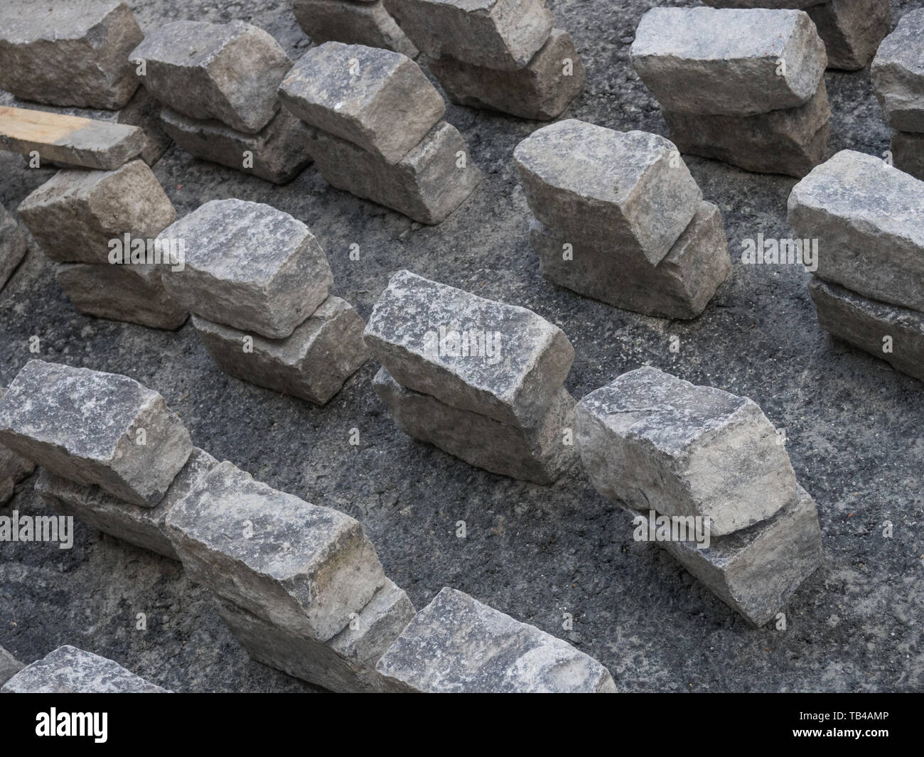 Grey stone bricks ready to place Stock Photo - Alamy