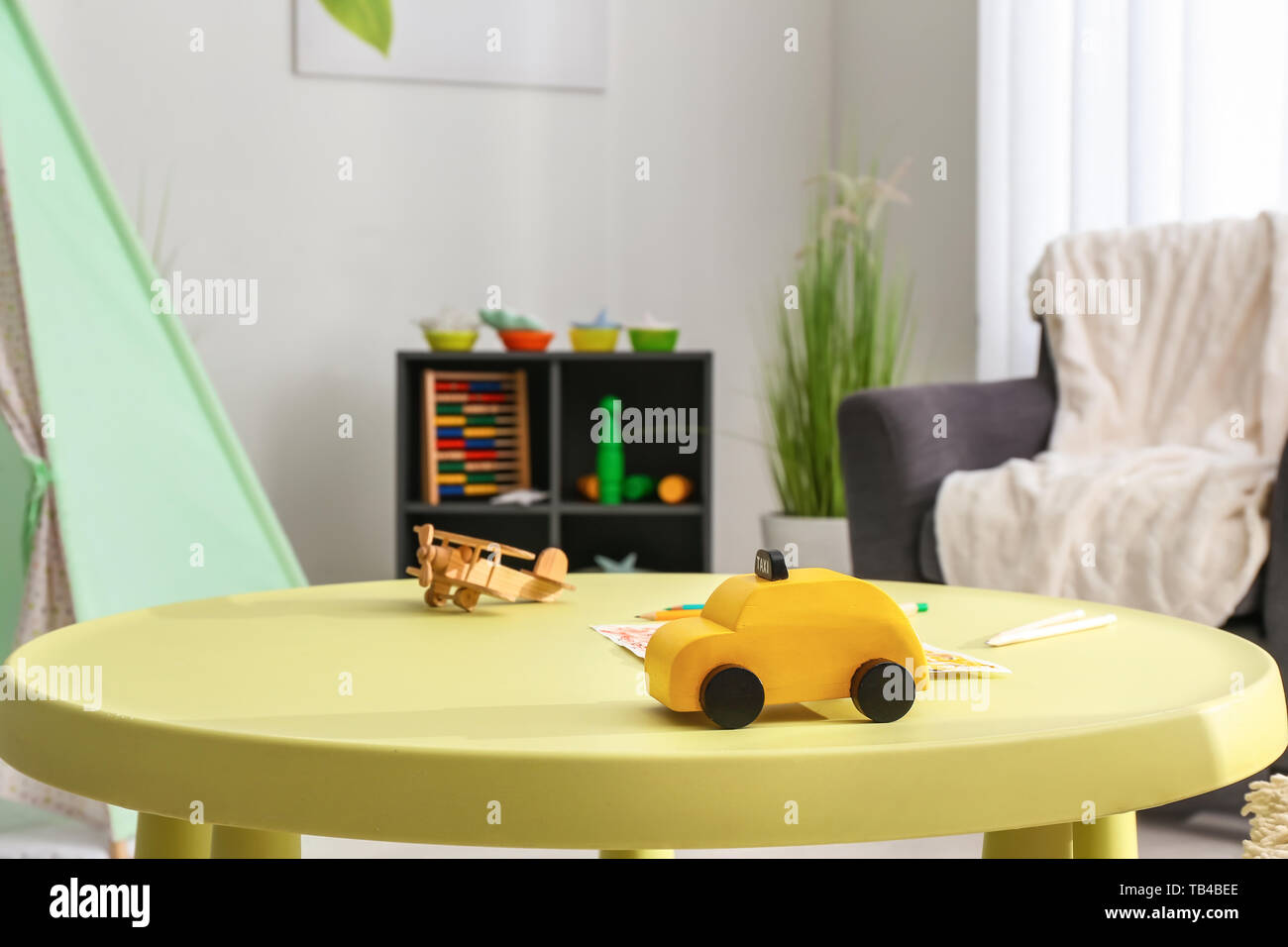 Toys on table in cozy kids room Stock Photo - Alamy