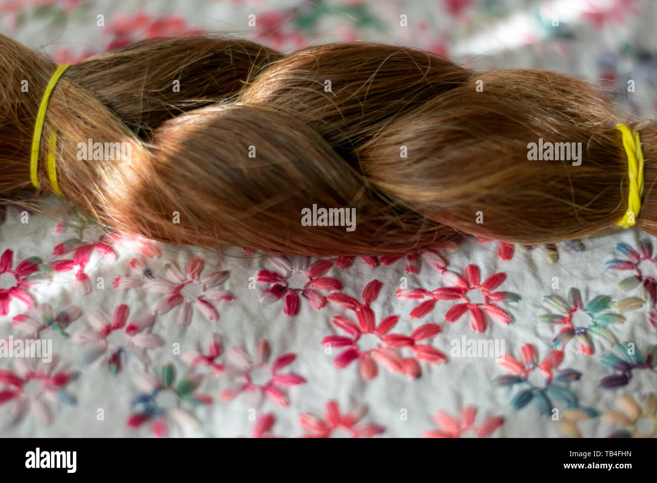 Braid hairstyle. Natural, healthy and red-haired hair on linen fabric ...