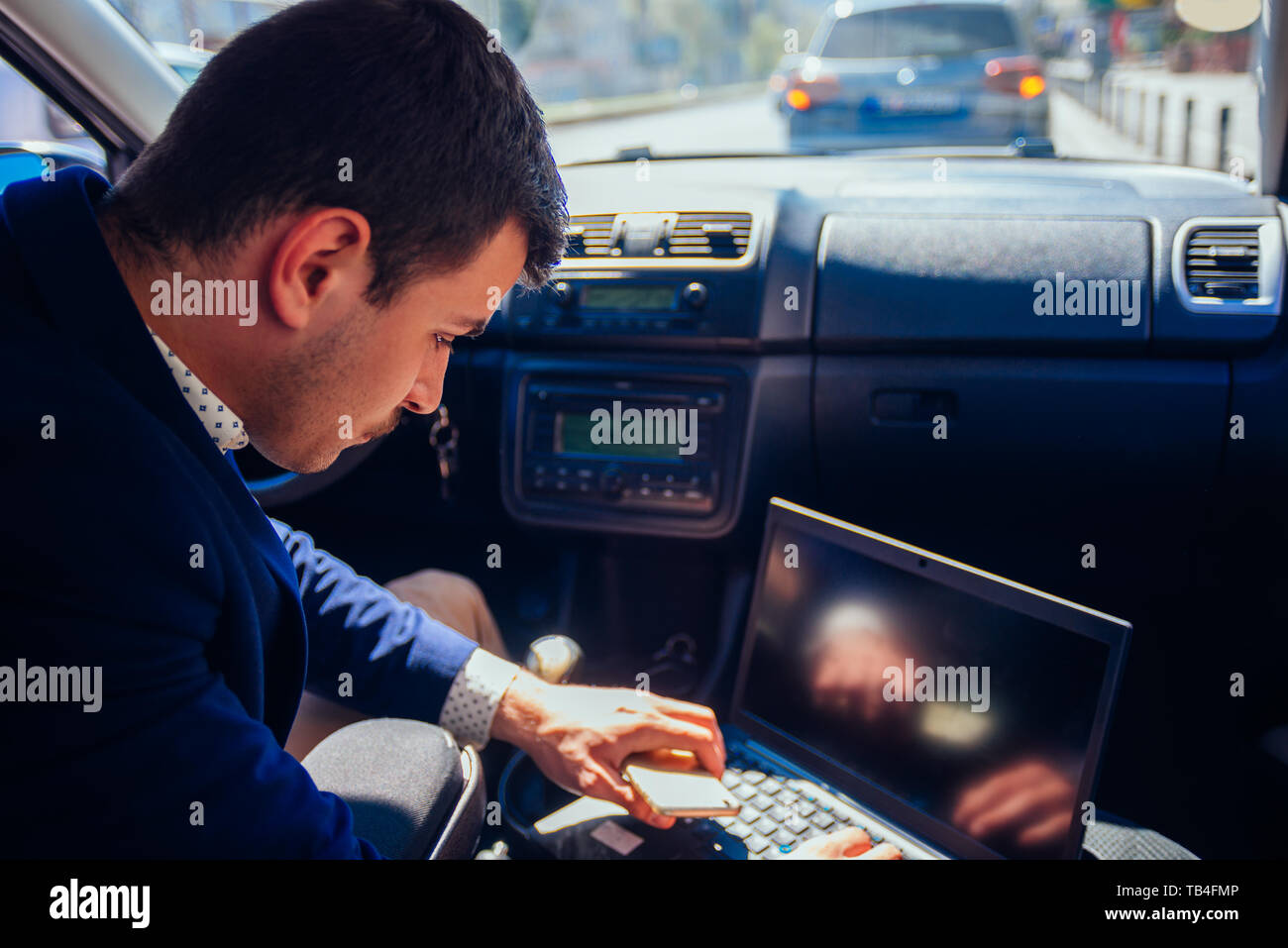 Reckless businessman driving in the city during the rush hour while ...