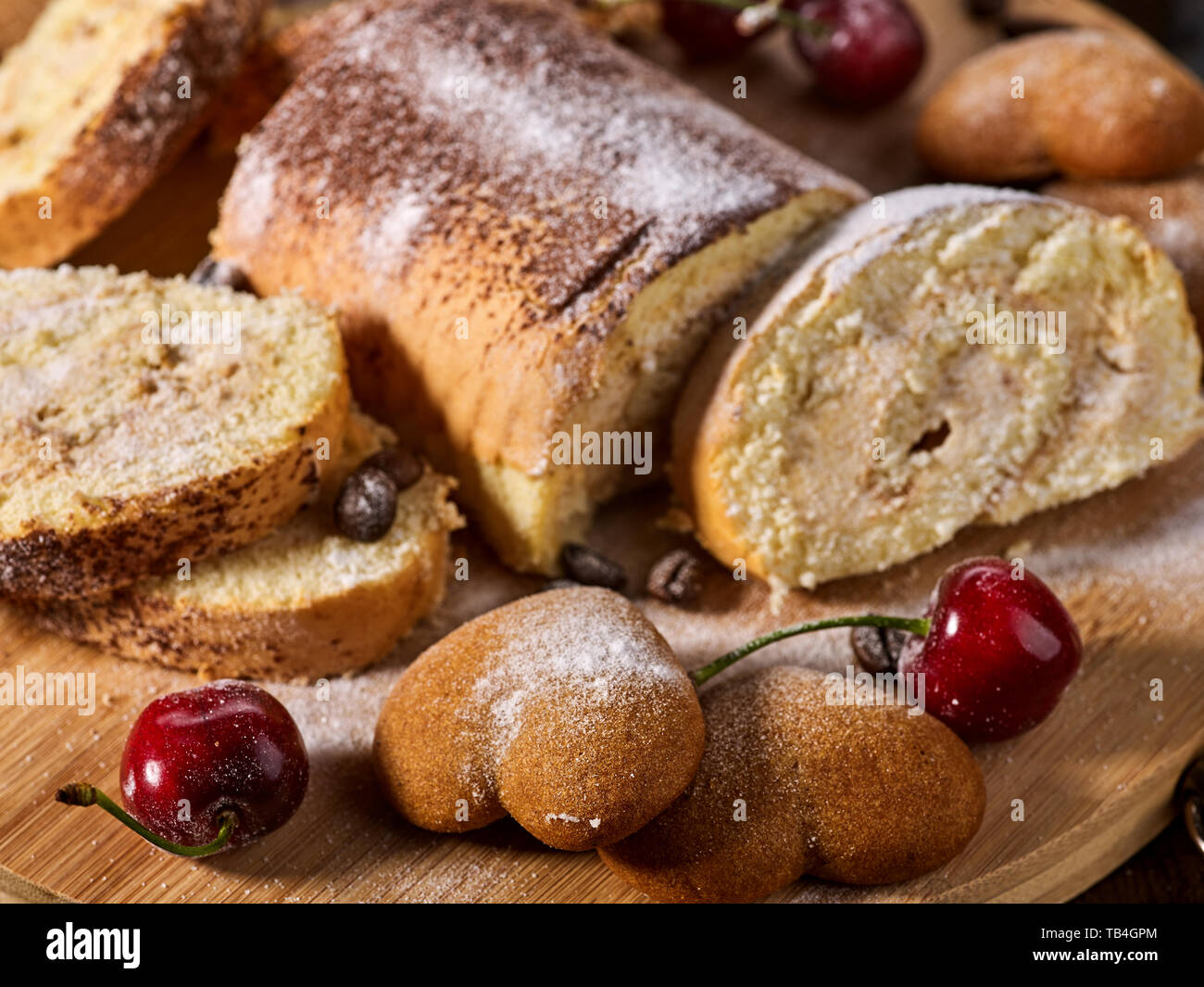 Rolled biscuit and sand chocolate cookies on board Stock Photo - Alamy