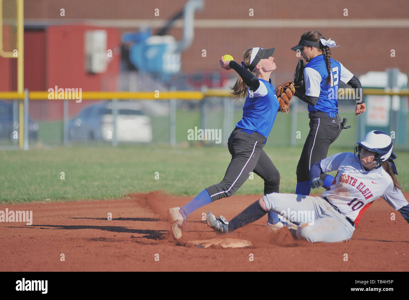 Shortstop coming across second base while forcing the sliding runner ...