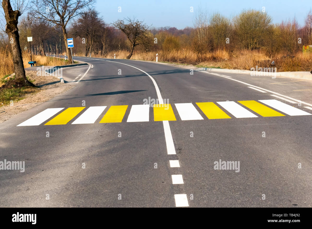 pedestrian crossing outside the city, white yellow marking of ...