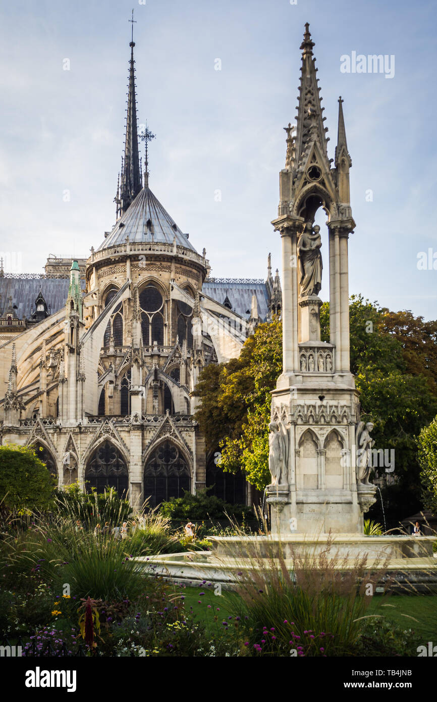 The back of Notre Dame Cathedral from the park in summer in Paris ...