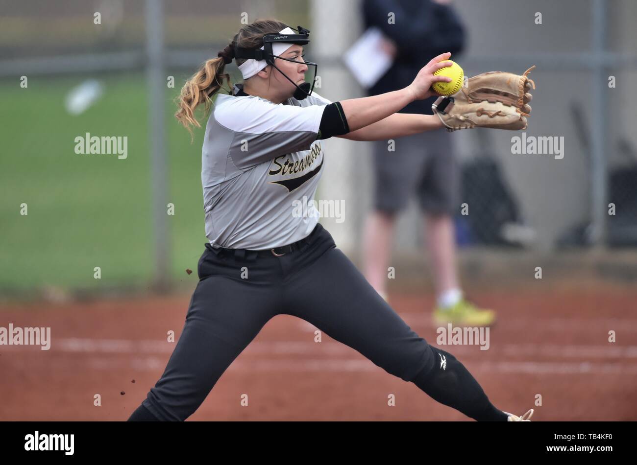 Pitcher in the circle for delivering a pitch to a waiting North hitter ...