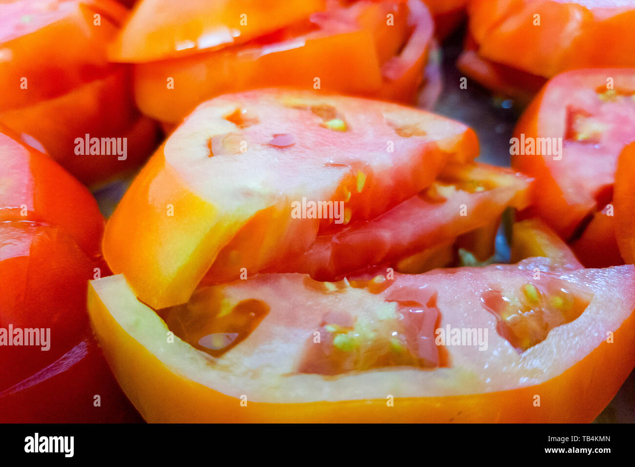 chopped tomato grouped in a tray Stock Photo - Alamy