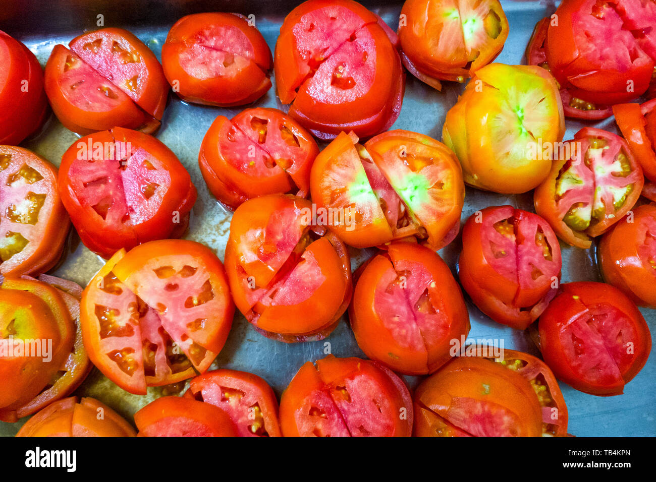 chopped tomato grouped in a tray Stock Photo - Alamy