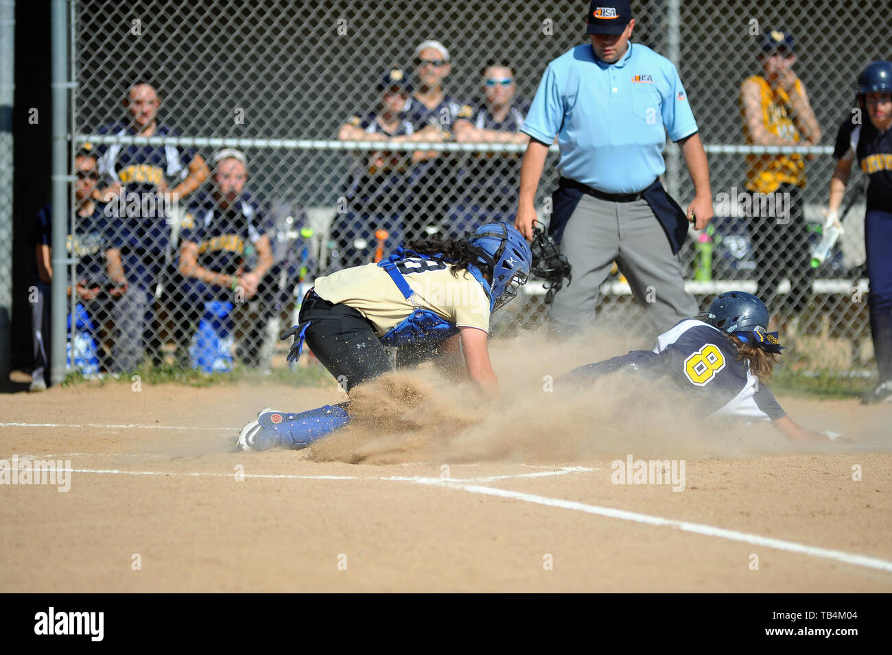 Girl softball player sliding into base hi-res stock photography and ...