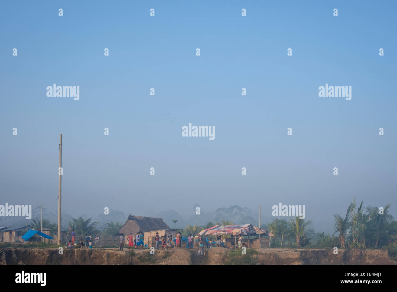 River community in a misty morning seen from the ferry Iquitos-Pucallpa ...
