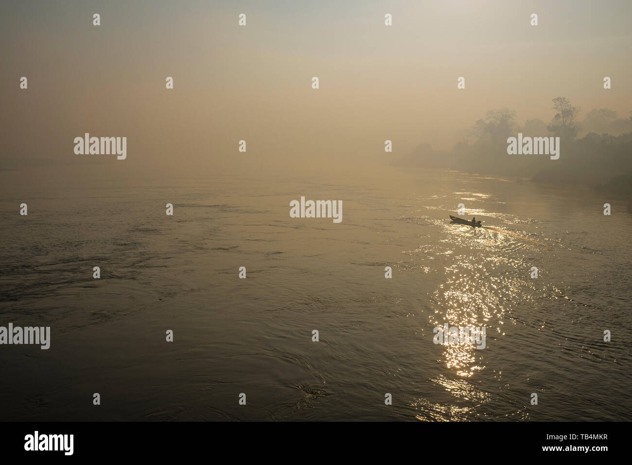 Misty morning in the Ucayali River seen from the ferry Iquitos-Pucallpa ...