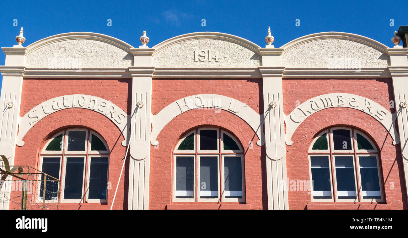 Facade of a late Edwardian commercial building, with parapet and light ...