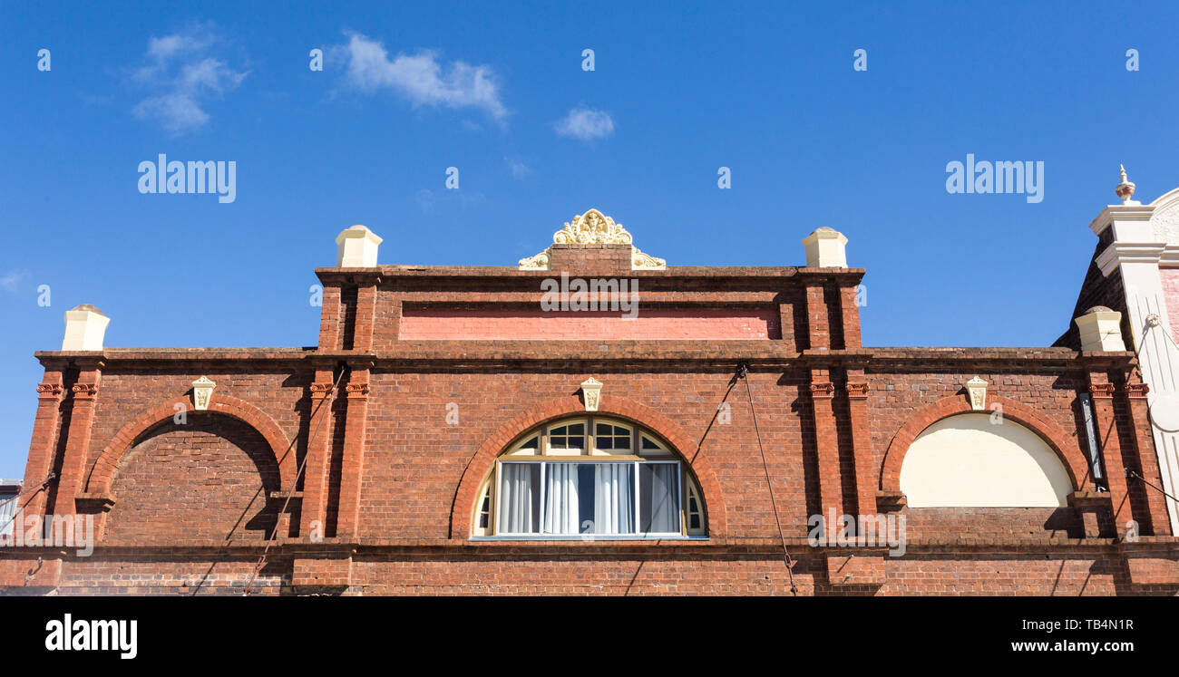Brick facade of a neo-classical residential building, with parapet ...