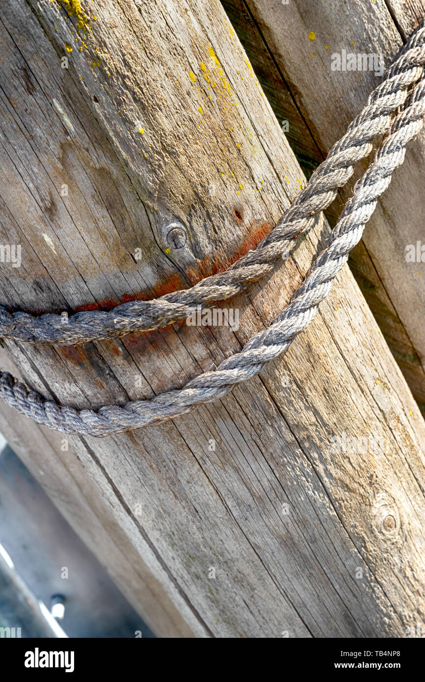 Abstract mooring rope close up on a wooden pylon Stock Photo - Alamy