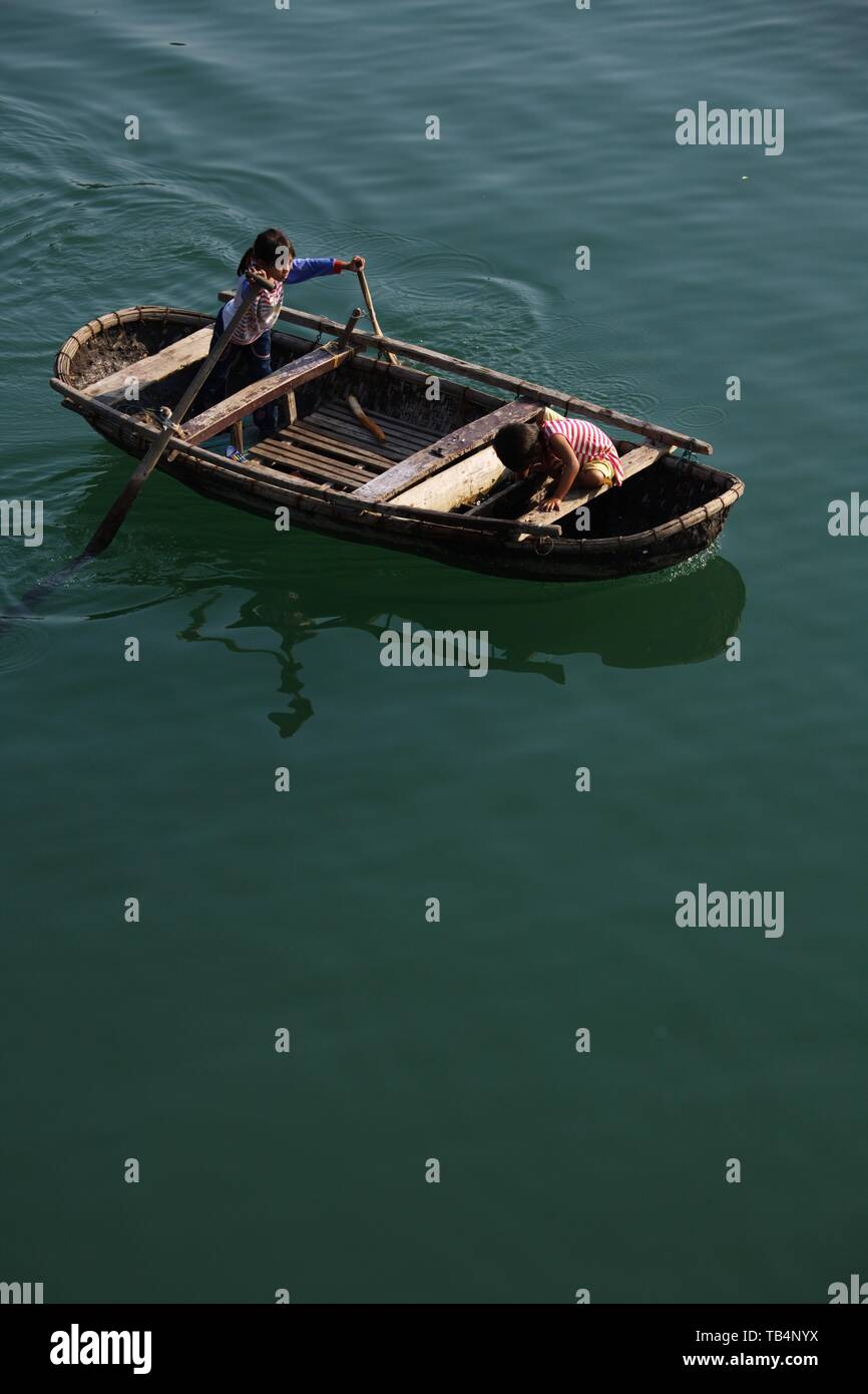 Boy on long boat hi-res stock photography and images - Alamy