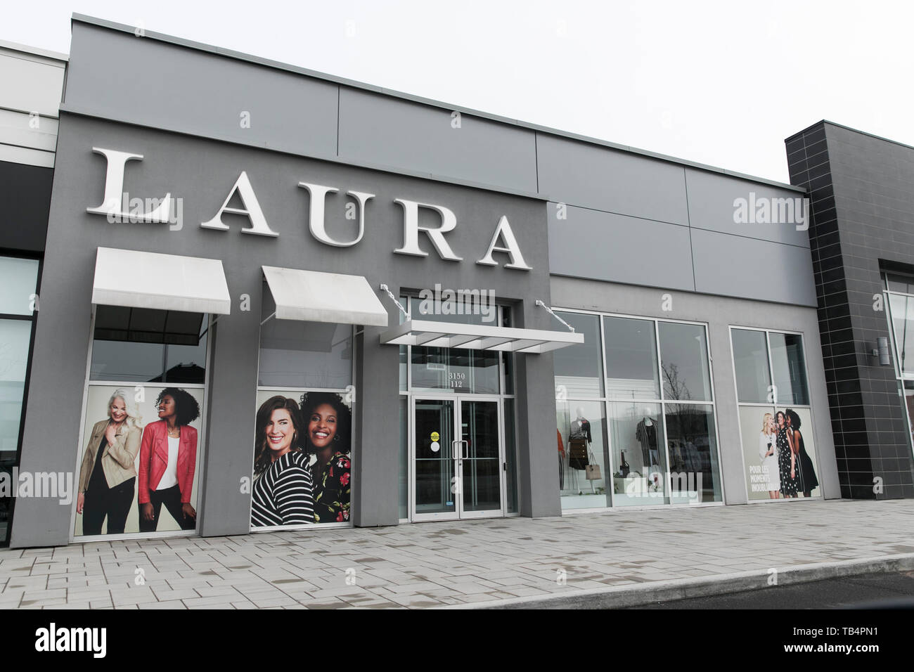 A logo sign outside of a Laura retail store location in Vaudreuil ...