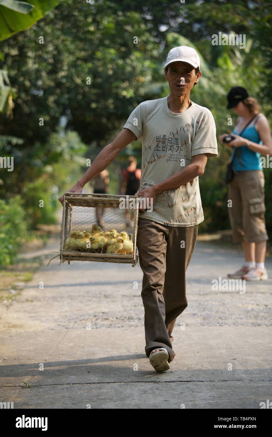 Man carrying bird cage hi-res stock photography and images - Alamy