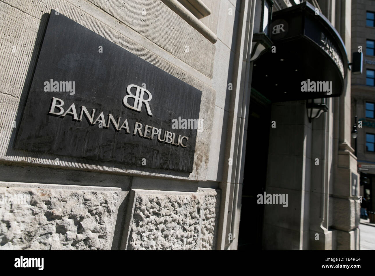 A logo sign outside of a Banana Republic retail store location in ...