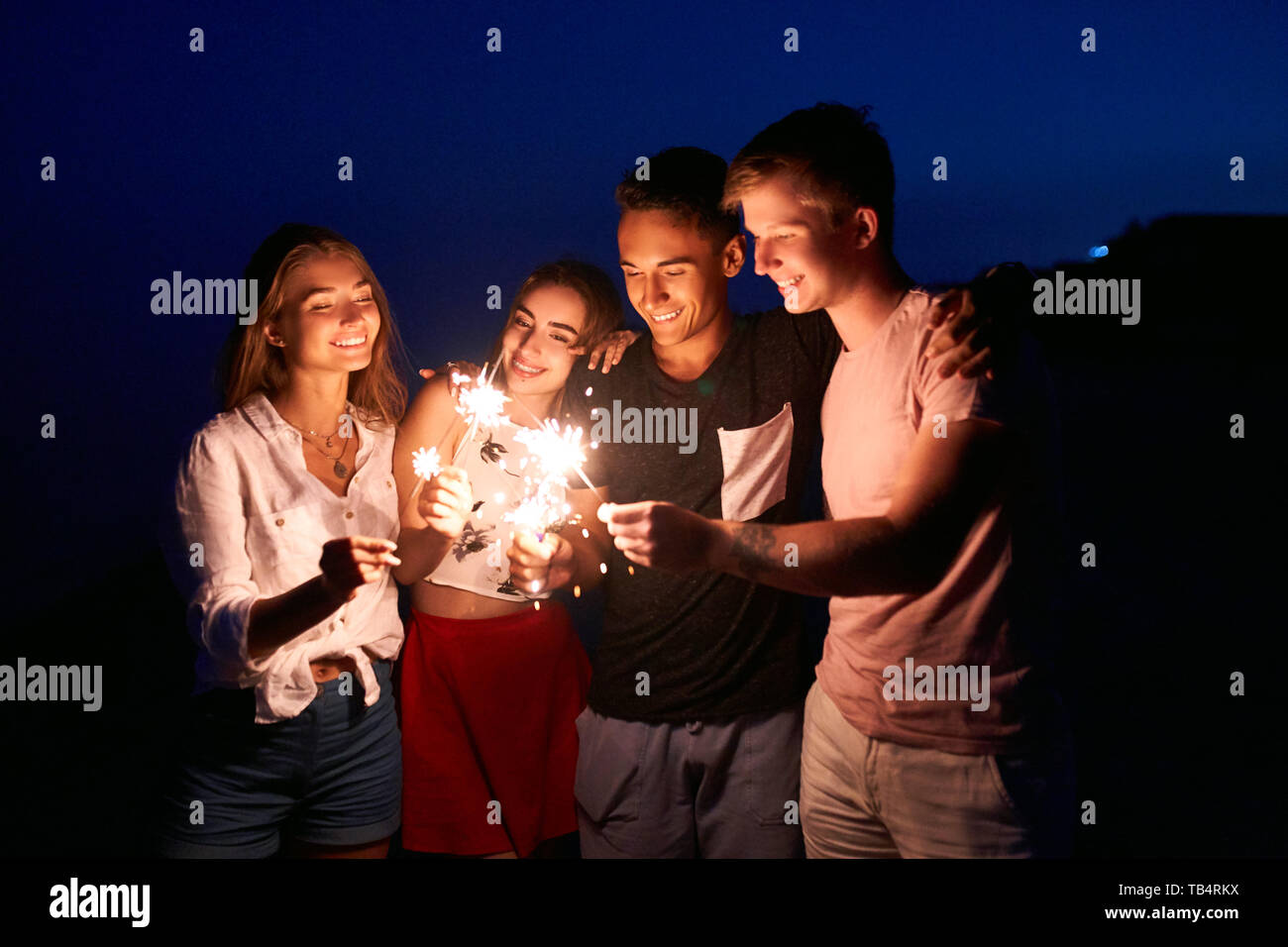 Friends walking, dancing and having fun during night party at the ...