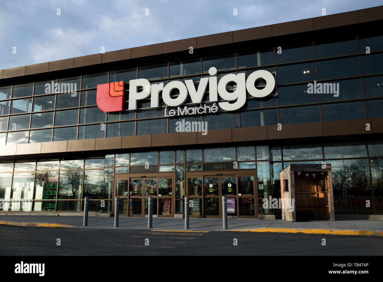 A logo sign outside of a Provigo retail grocery store location in ...