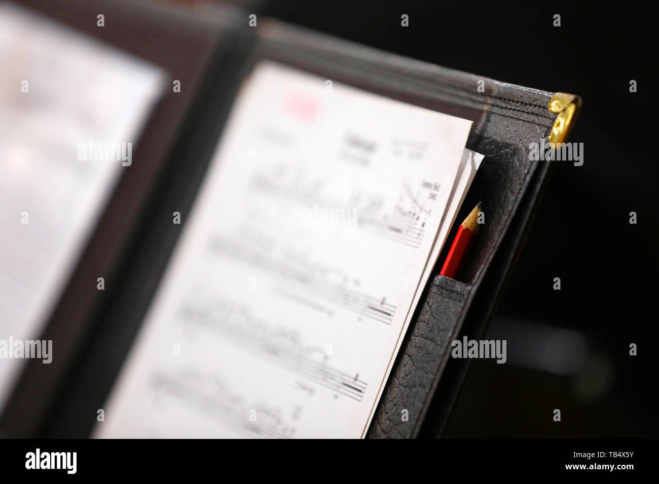 Black leather music score sheet folder with red pencil and brass corner ...