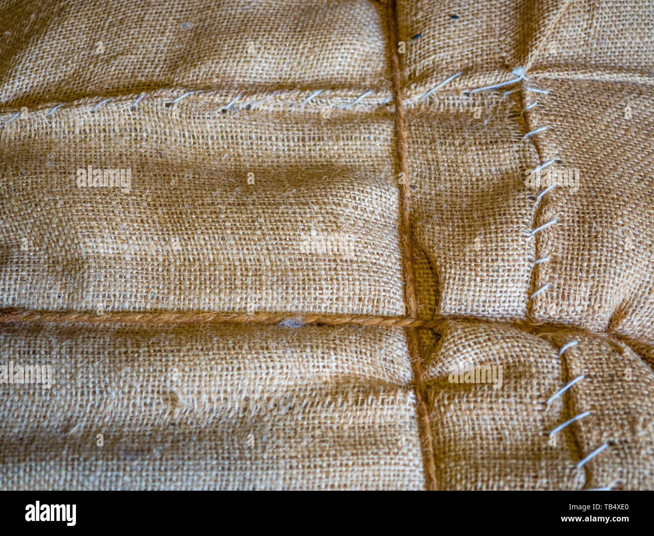 Brown burlap with twine stitching background Stock Photo - Alamy