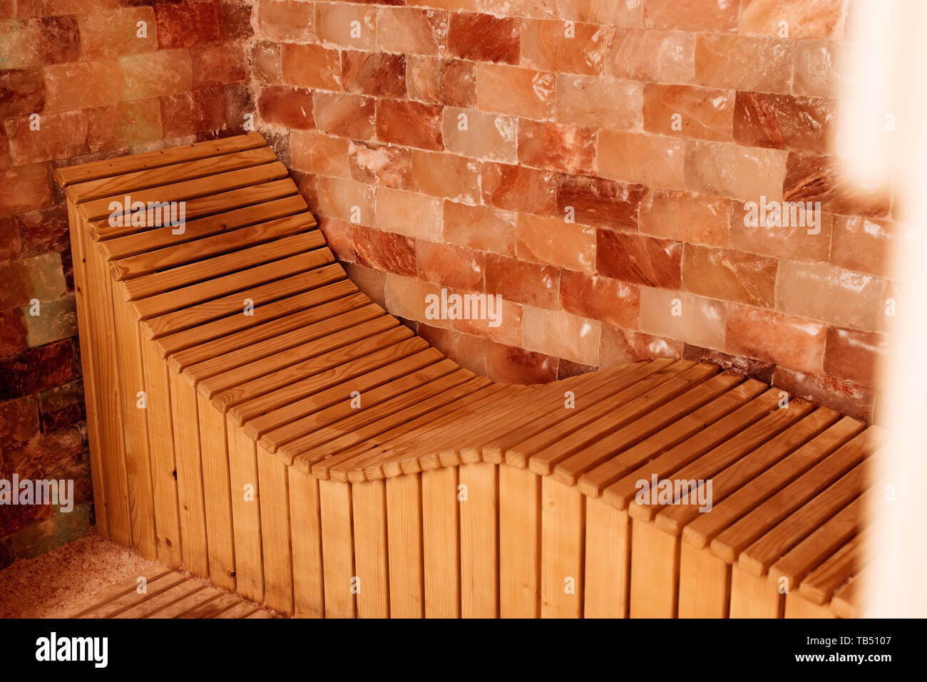wooden bench in spa center with textured walls Stock Photo - Alamy