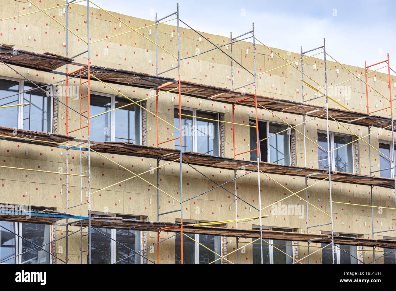 exterior wall thermal protection. building facade under renovation with ...