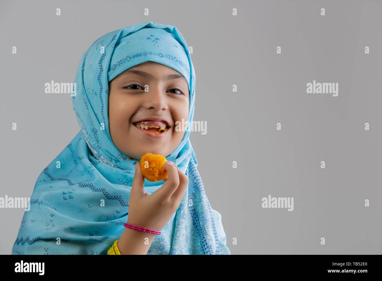 Muslim child eating hi-res stock photography and images - Alamy