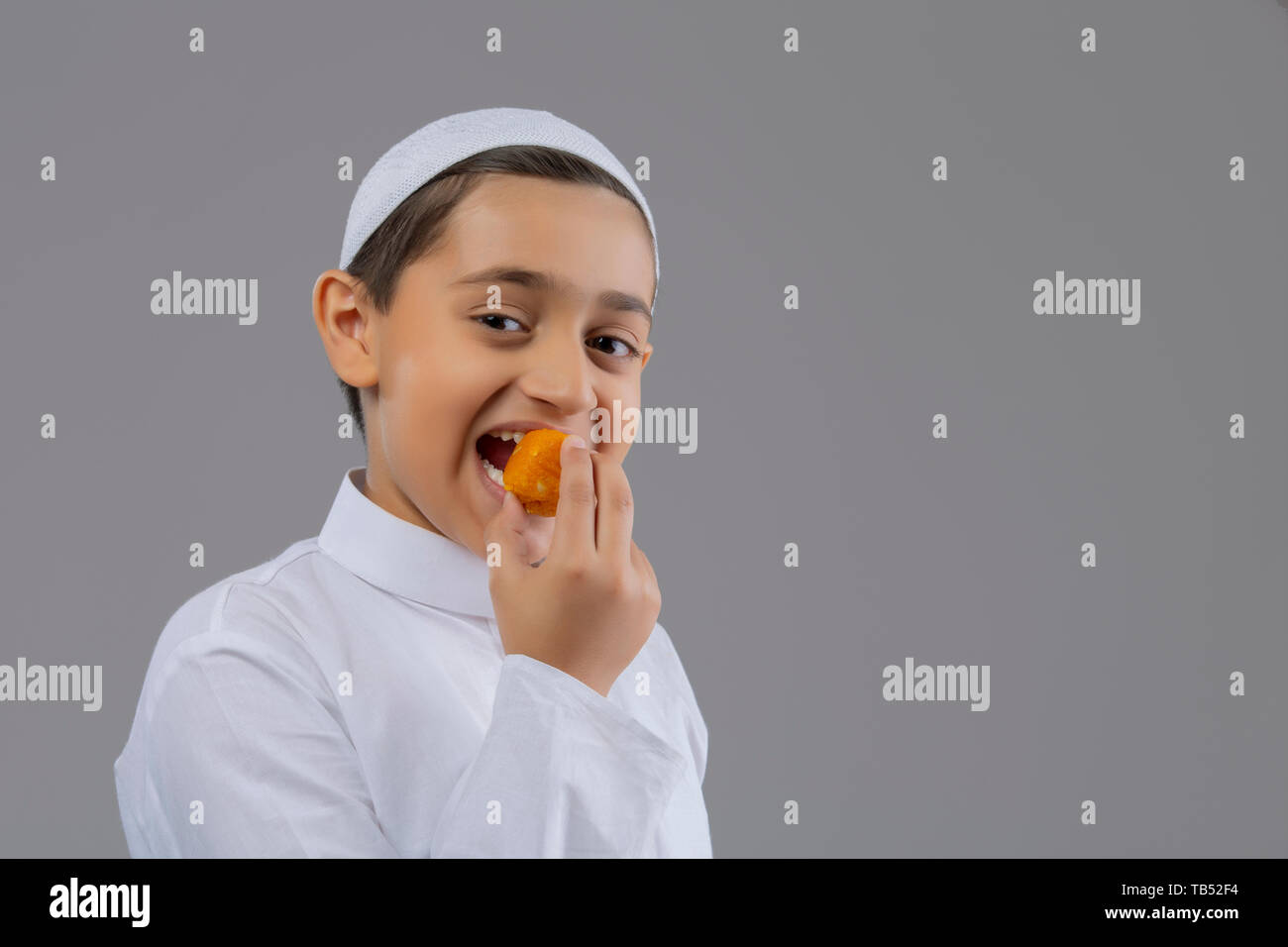 Muslim Boy Eating High Resolution Stock Photography and Images - Alamy