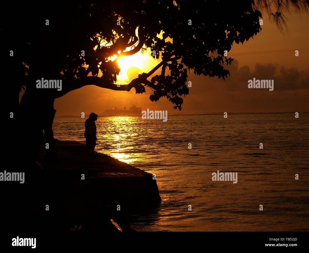 Beautiful golden sunset casting glorious reflections on the waters of ...