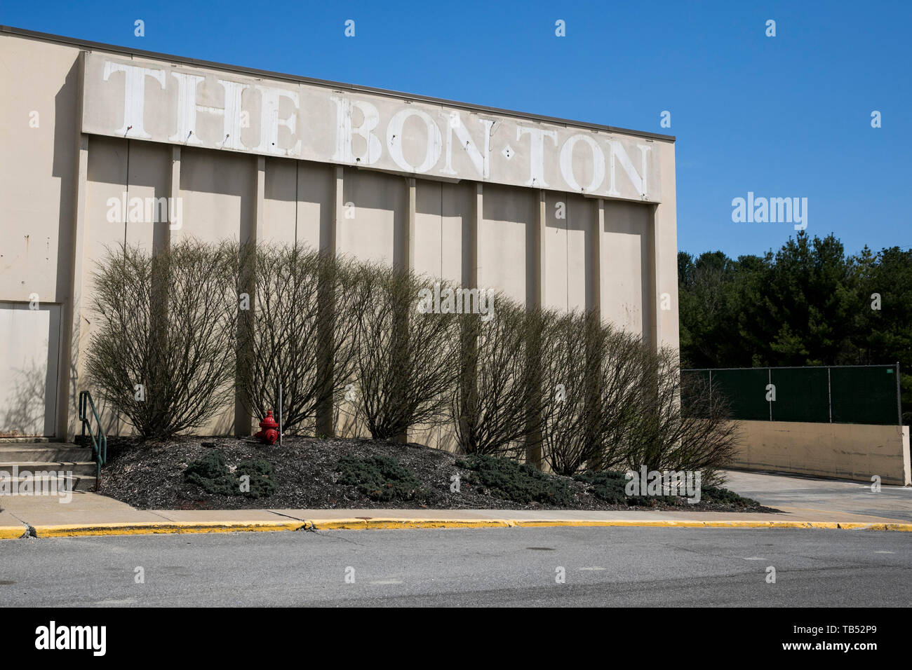 The outline of a The Bon-Ton logo sign outside of a closed retail store ...