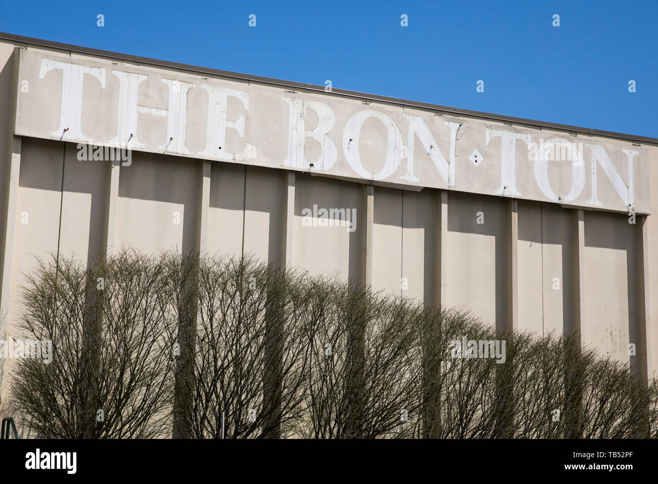 The outline of a The Bon-Ton logo sign outside of a closed retail store ...