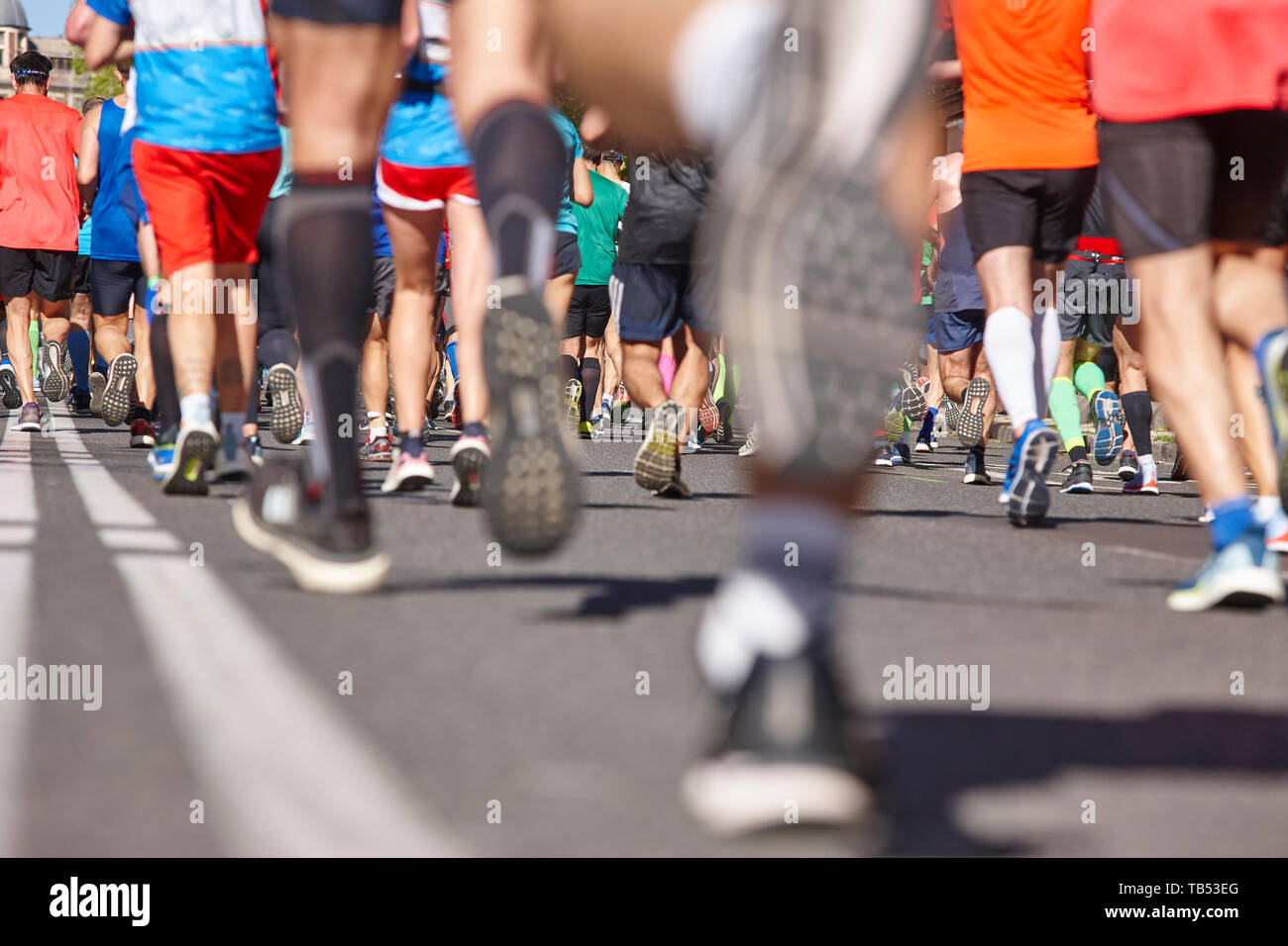 Marathon runners on the street. Healthy lifestyle. Urban athlete ...