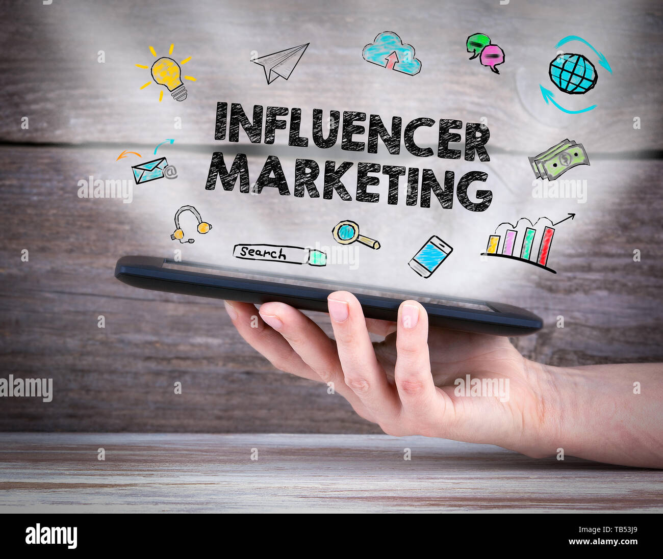 Influencer marketing concept. Tablet computer in the hand Stock Photo ...