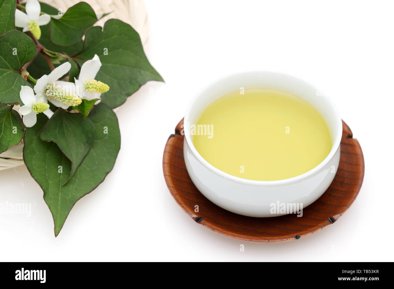 Houttuynia cordata tea, healthy dokudami drink, on white background ...