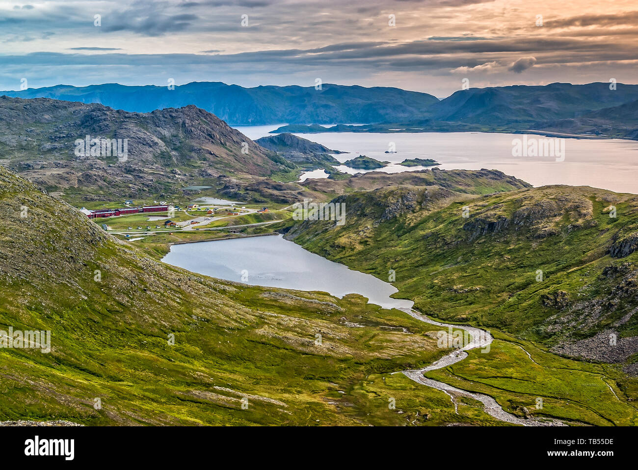 Summer Norwegian landscape with green hills, sea bay, lake and camp ...