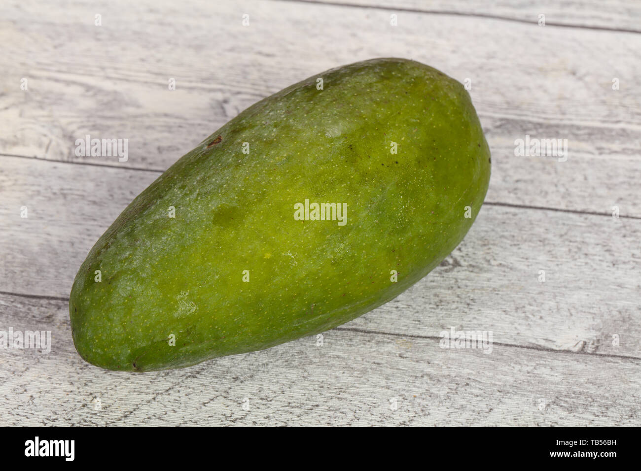 Green tasty mango over background Stock Photo - Alamy