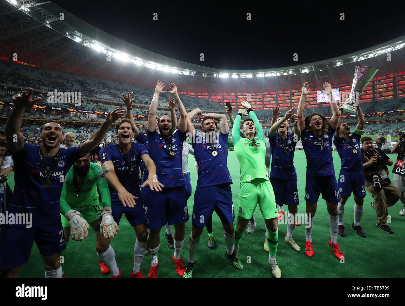 Chelsea players celebrate with the trophy after winning the UEFA Europa ...