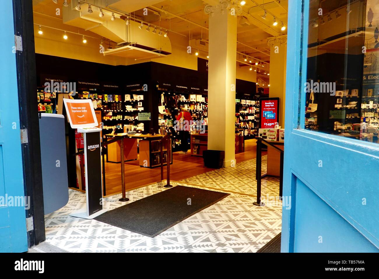 Amazon retail store with person shopping, New York, NY, USA Stock Photo ...