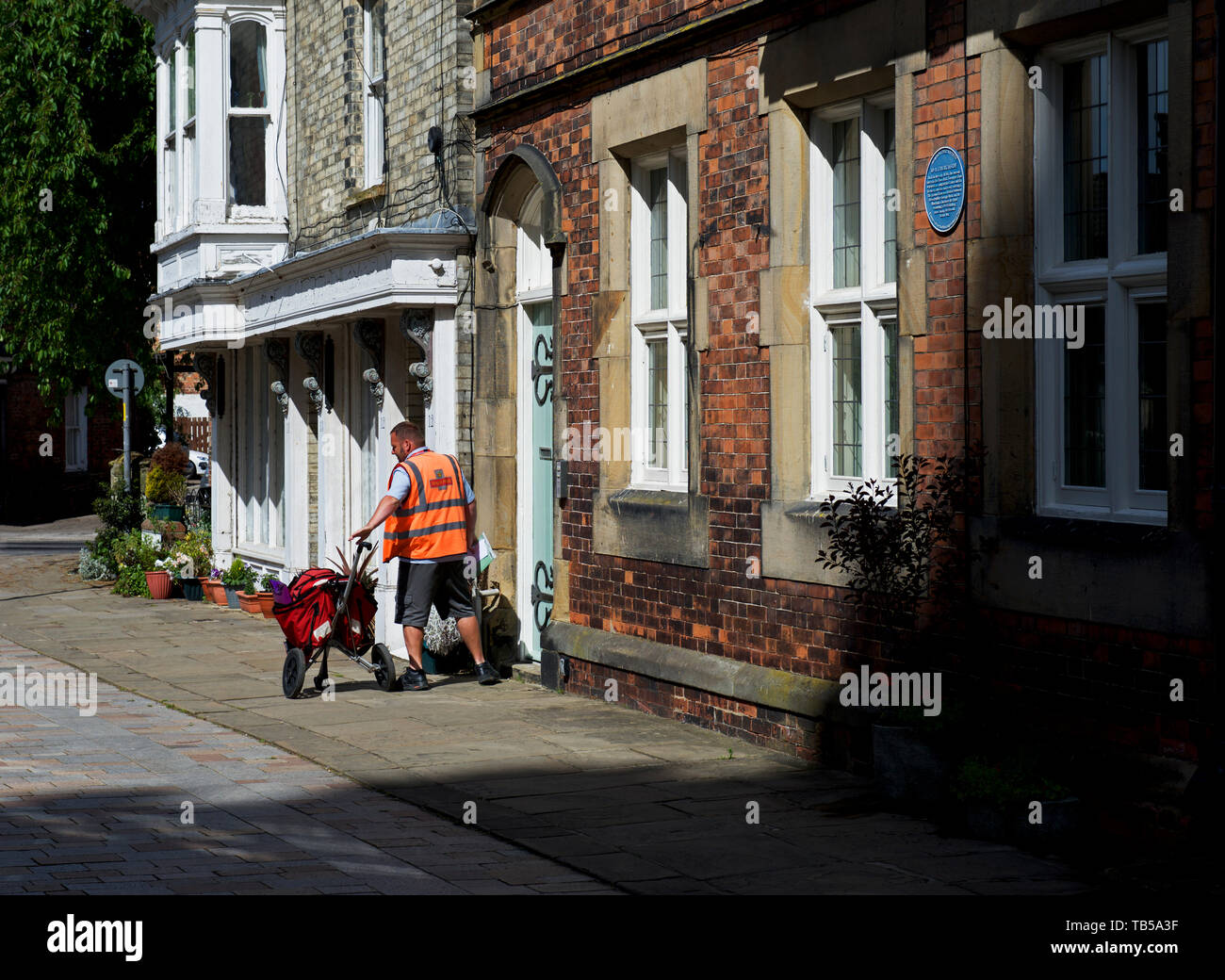 English postman uniform hi-res stock photography and images - Alamy