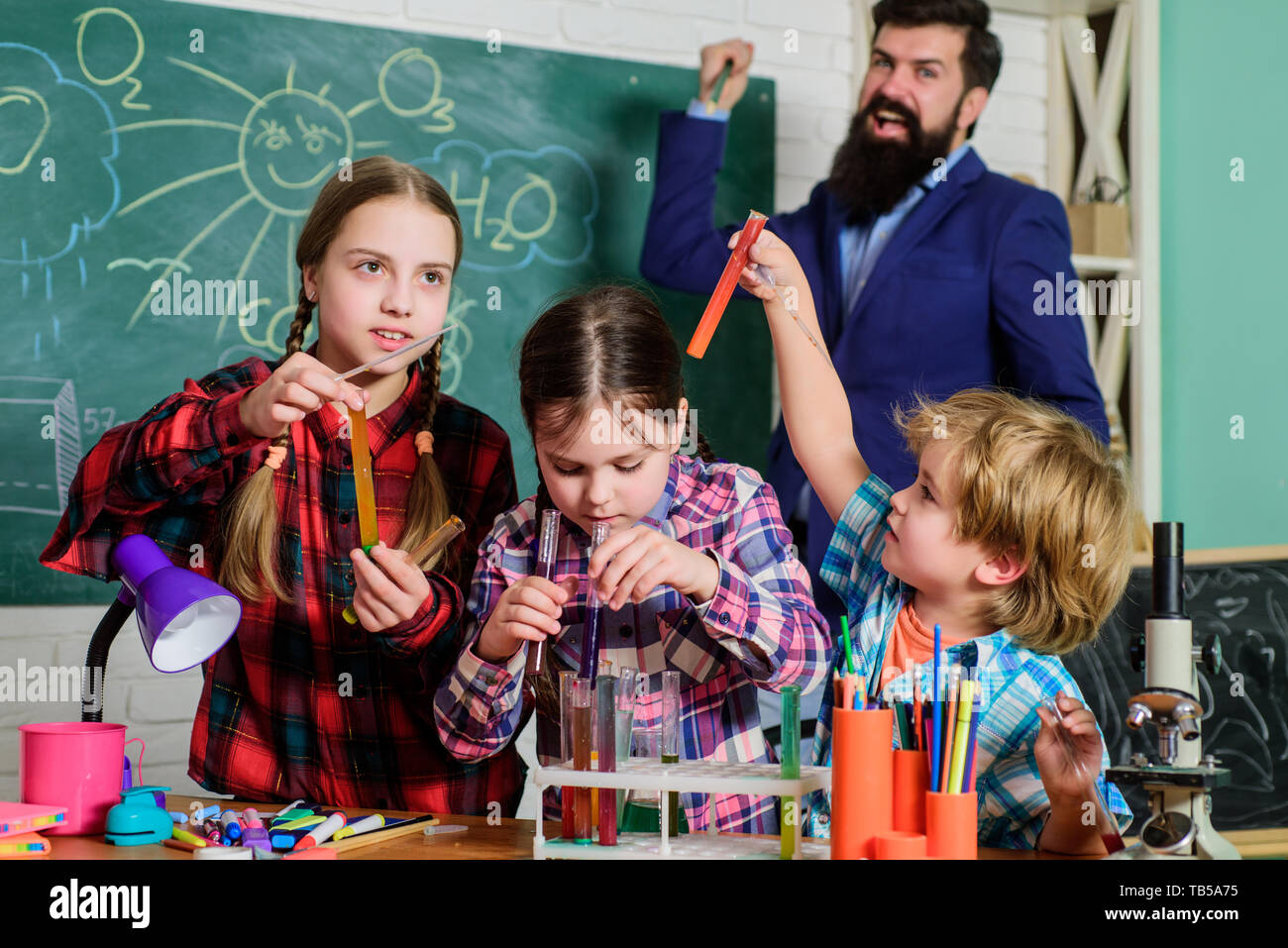 children making science experiments. Education. chemistry lab. happy ...