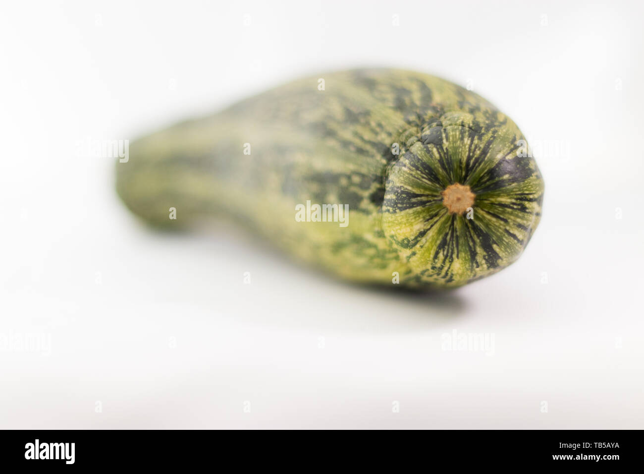 green vegetable zuquini on white background Stock Photo - Alamy