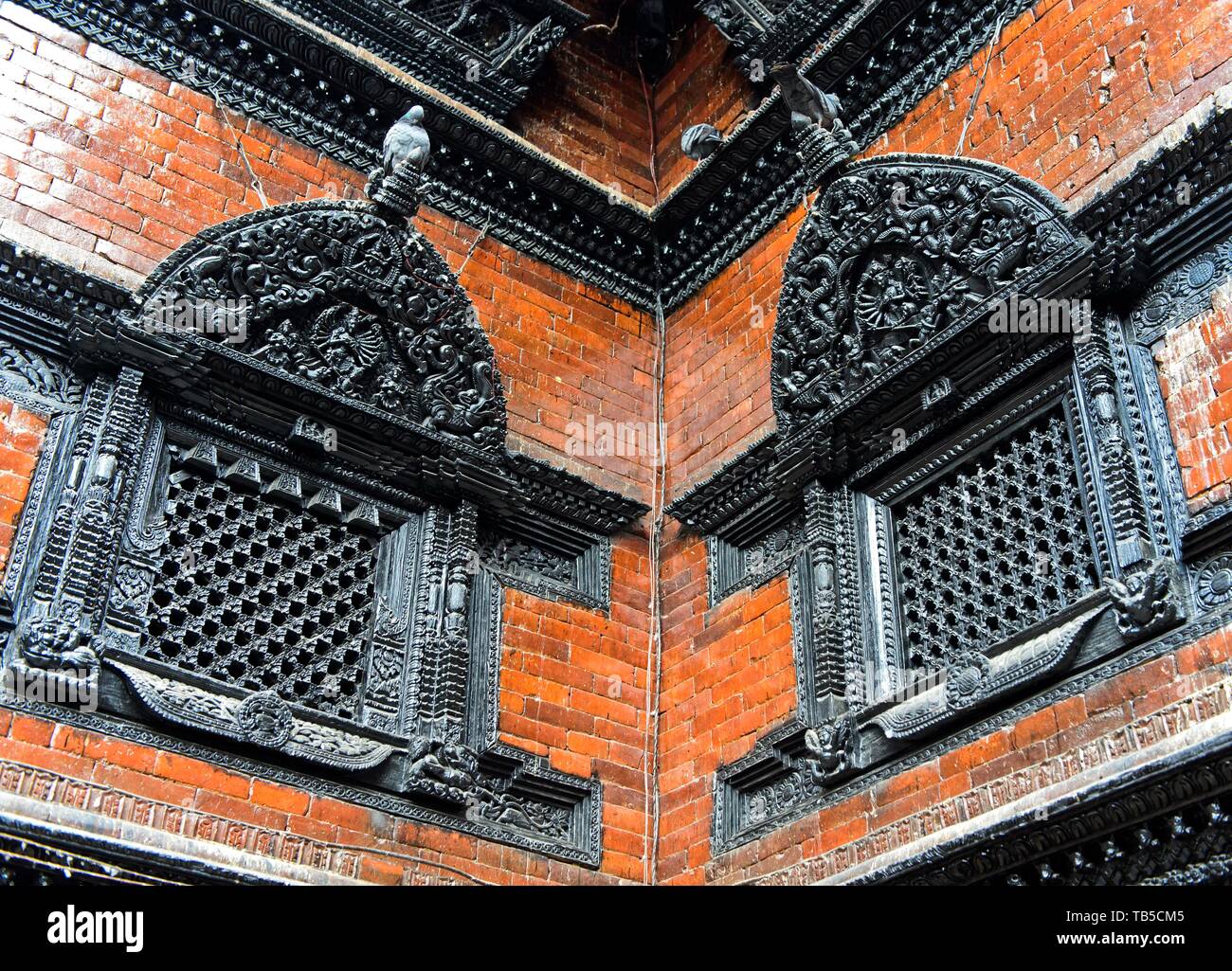 Artfully carved window grilles in traditional Newar style in Kumari ...
