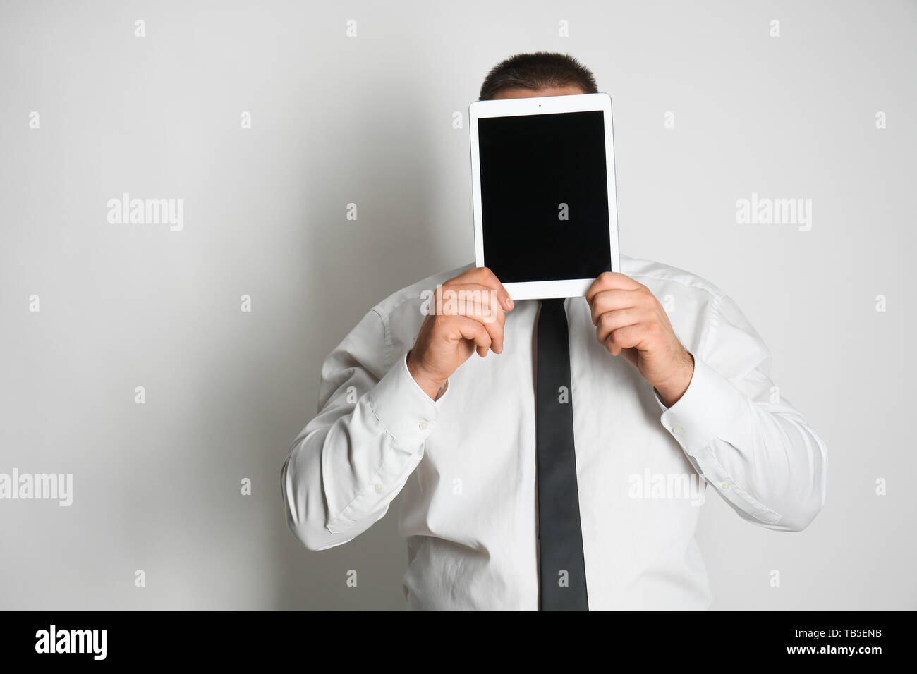 Man hiding behind computer hi-res stock photography and images - Alamy