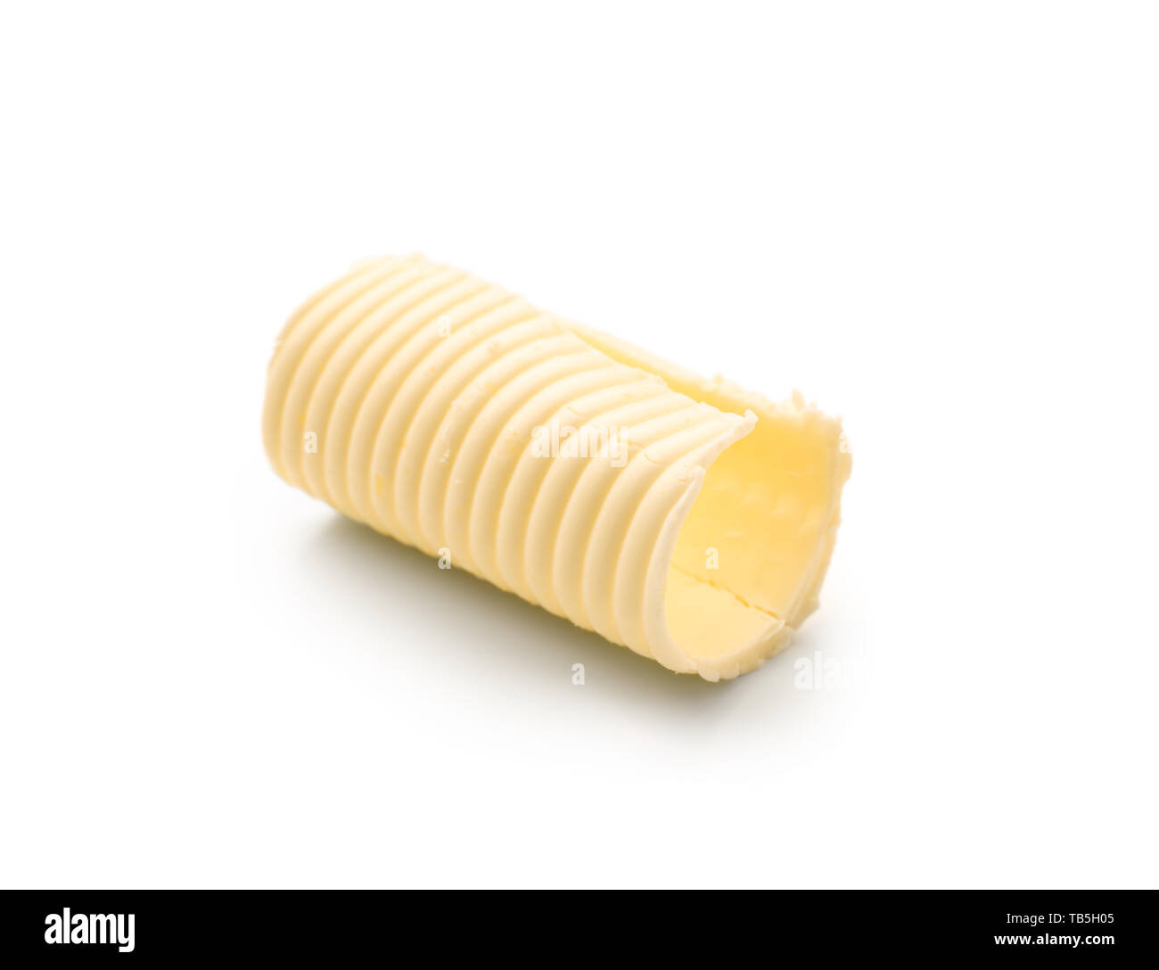 Butter curl on white background Stock Photo - Alamy