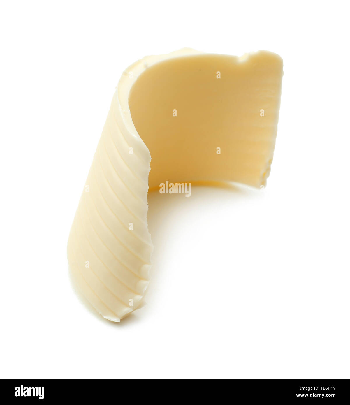 Butter curl on white background Stock Photo - Alamy