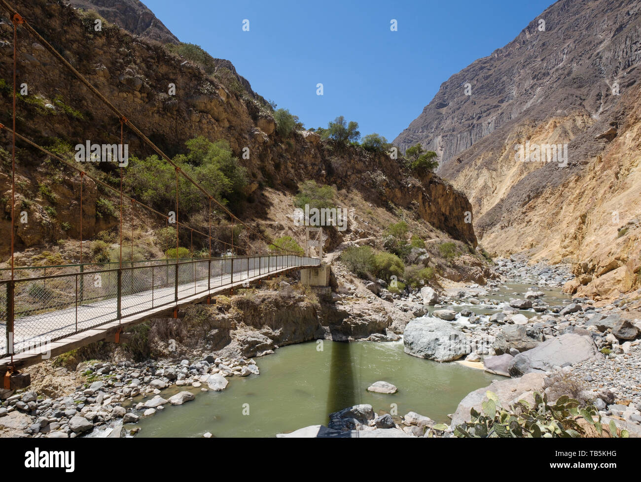 Trail and bridge to cross the Colca River at the Colca Canyon ...