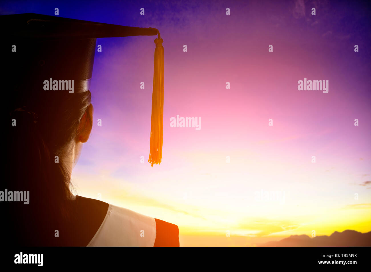 rear view silhouette of Student Graduation watching the sunrise Stock ...