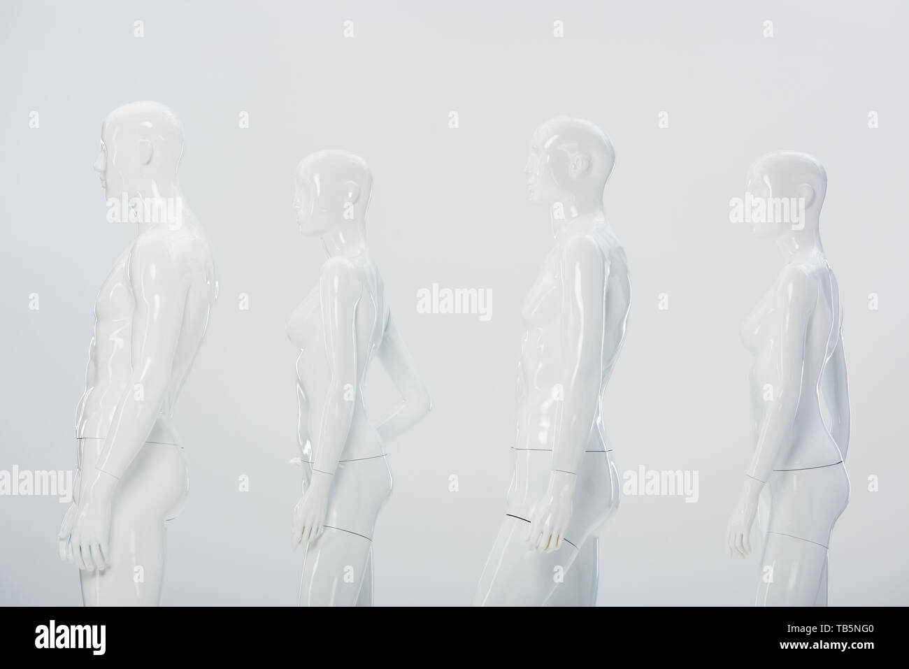 white plastic dummies in row isolated on grey Stock Photo - Alamy