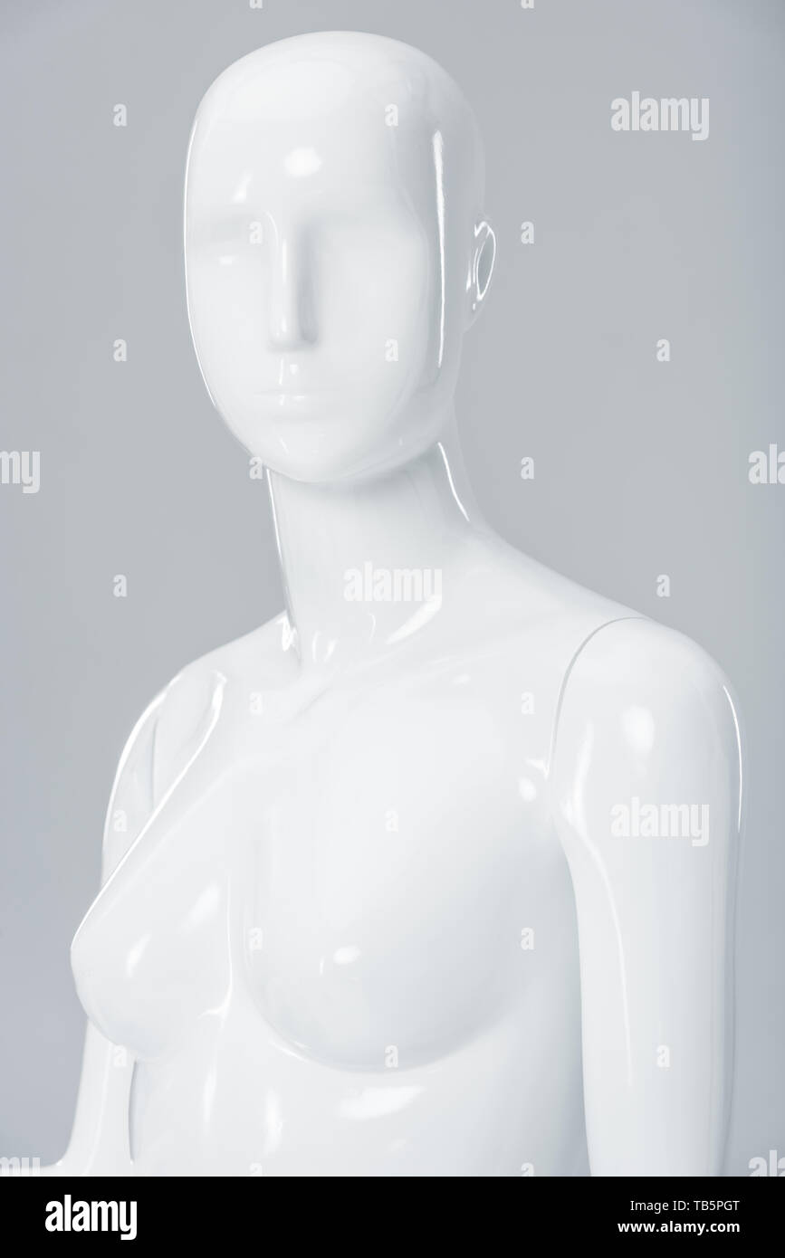 white plastic mannequin figure isolated on grey Stock Photo - Alamy